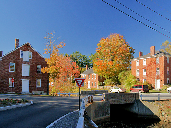 Storybook perfection isn't Photoshopped here—Harrisville's historic buildings embrace the millpond like old friends catching up after a long winter.