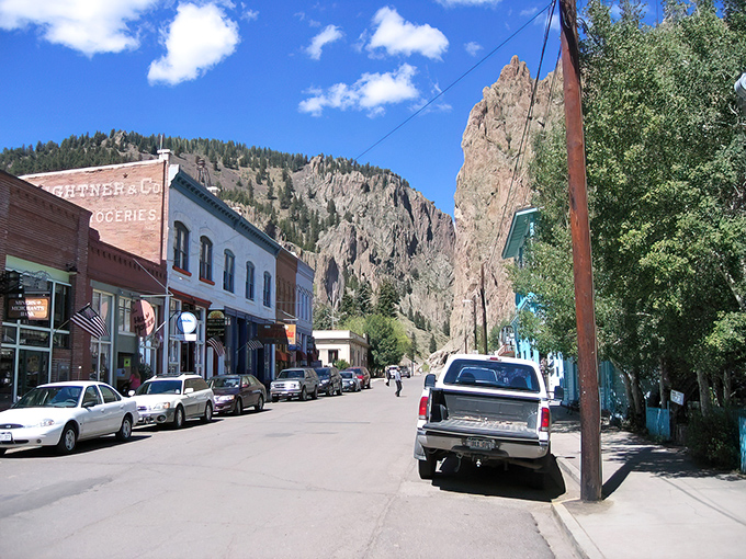Downtown Creede stretches before you like a living postcard, where towering cliff walls play guardian to a main street that hasn't forgotten what year it was built.