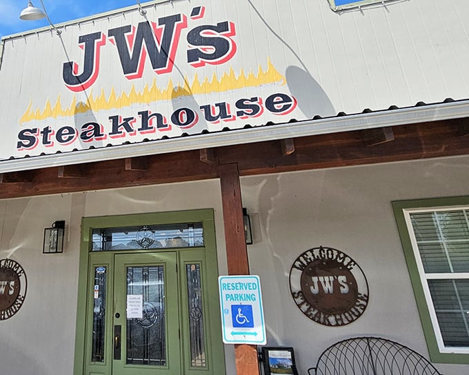 The unassuming exterior of J W's Steakhouse promises little but delivers everything—like finding a diamond in a haystack that happens to serve perfect steaks.