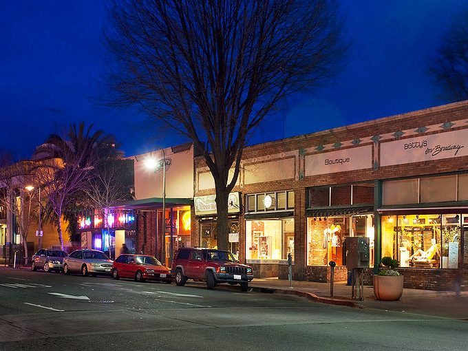 Downtown Chico's city plaza showcases architectural charm with its iconic arches and sculptures – a pocket of urban elegance surrounded by shady trees.