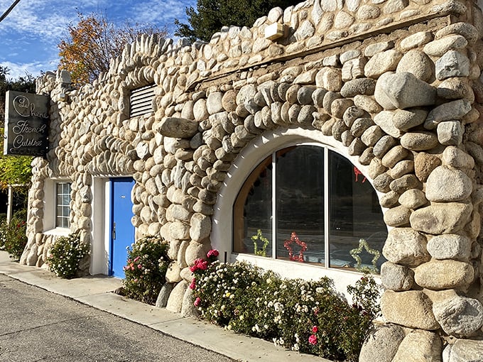 Like a fairy tale cottage that took a wrong turn at Provence, Le Chêne's stone exterior promises culinary magic before you even step inside.