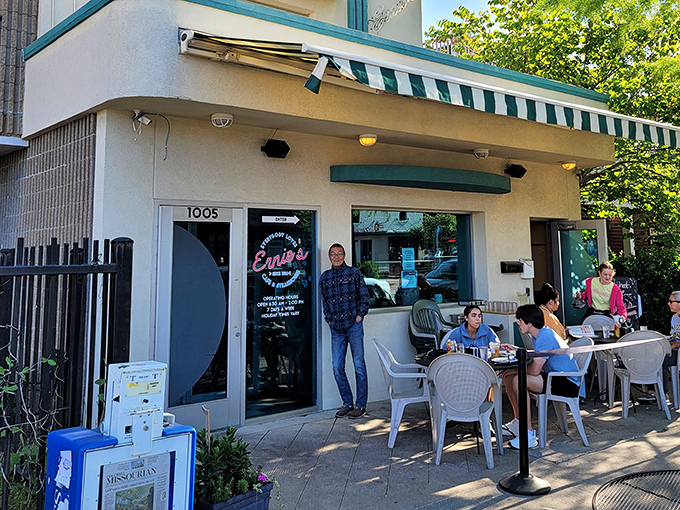 Ernie's welcoming exterior beckons with its classic green awning and outdoor seating—a Columbia landmark where breakfast dreams come true.