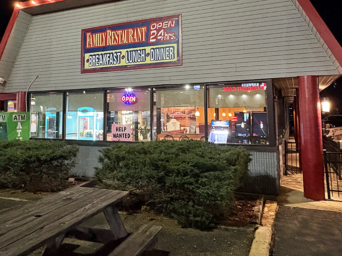 The neon glow of "OPEN 24 hrs" isn't just a sign—it's a beacon of hope for hungry souls at any hour. Classic diner architecture with a promise of comfort inside.