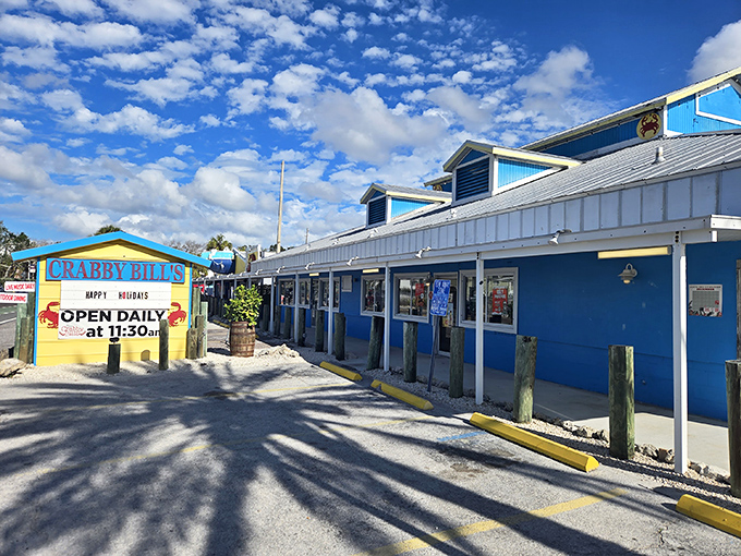 The iconic turquoise exterior of Crabby Bill's stands out against the Florida sky like a beacon for hungry beachgoers seeking seafood salvation.