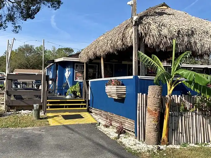 The unassuming exterior of Dan's Clam Stand proves once again that in Florida, the most magical seafood experiences often hide behind the simplest facades.