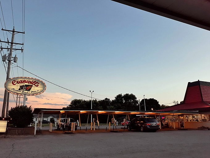 The iconic red roof and yellow poles of Cranwill's stand like a time capsule against the Illinois sky, beckoning hungry travelers to step back into simpler times.
