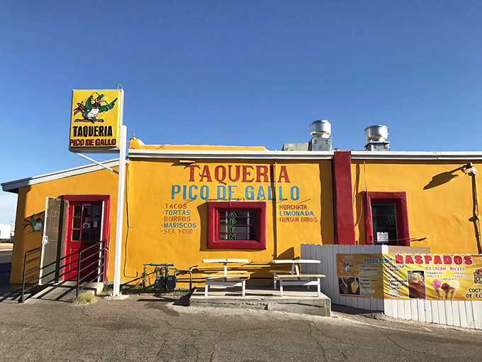 The sunshine-yellow exterior isn't just a building—it's a beacon of hope for hungry travelers across Arizona's desert landscape.