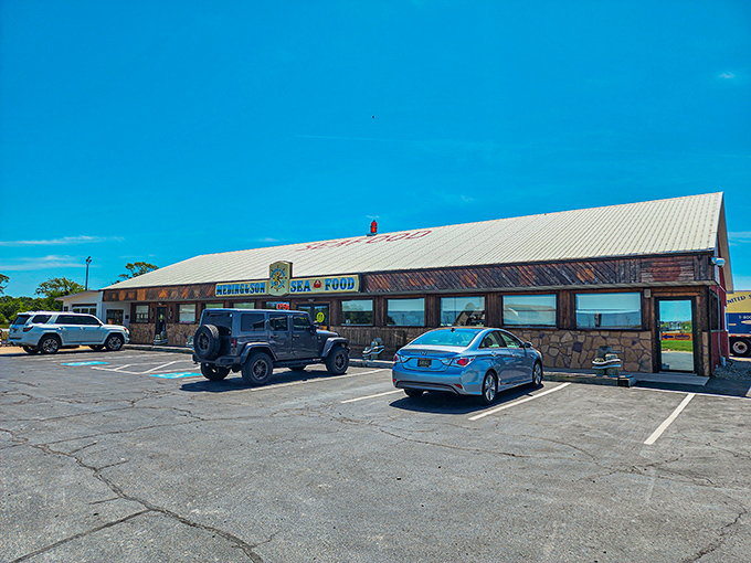 The blue and yellow sign beckons like a lighthouse for hungry sailors. Meding's weathered wooden exterior promises authentic seafood without pretension.