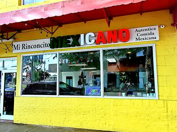 The sunshine-yellow exterior with its festive red awning isn't just a restaurant—it's a landmark for burrito pilgrims throughout Florida.