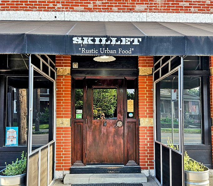 Skillet's unassuming brick exterior in Columbus hides culinary treasures within. The black awning whispers promises that the food inside shouts from the rooftops.