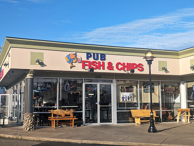 The unassuming exterior of Pub Fish & Chips hides culinary treasures within. That blue marlin sculpture? Consider it your first clue to seafood excellence.