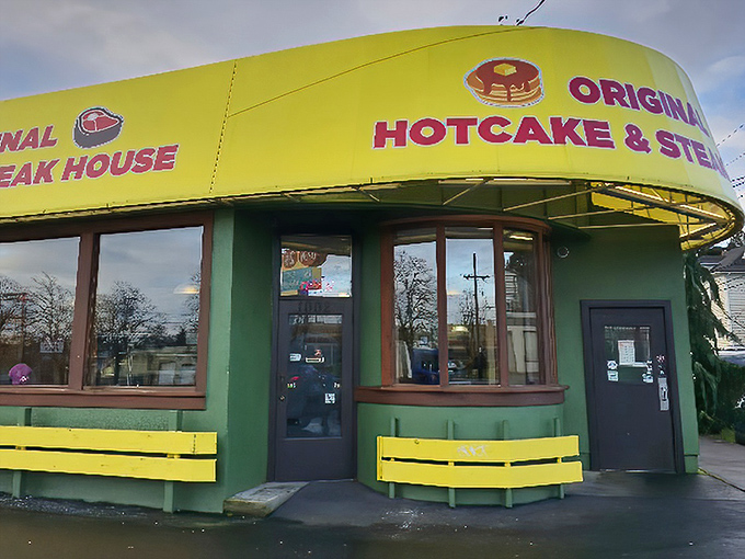 The green building with its sunshine-yellow awning stands like a beacon of breakfast hope on Powell Boulevard. No architectural awards here—just promises of pancake perfection. 