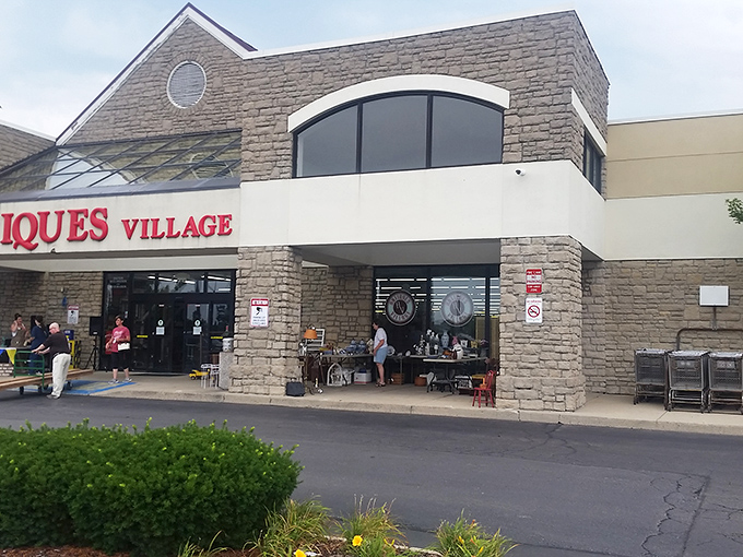 That red lettering practically shouts "treasure hunt ahead" – and the stone facade promises serious antiquing business inside.