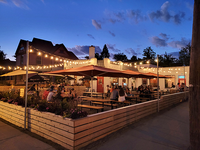 Twilight transforms this former service station into a magical oasis, where string lights and happy diners create the perfect Michigan summer evening vibe.