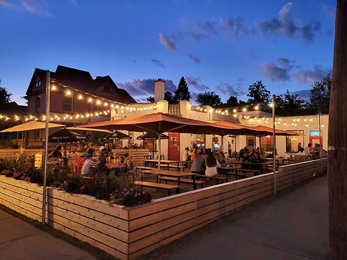 Twilight transforms this former service station into a magical oasis, where string lights and happy diners create the perfect Michigan summer evening vibe.