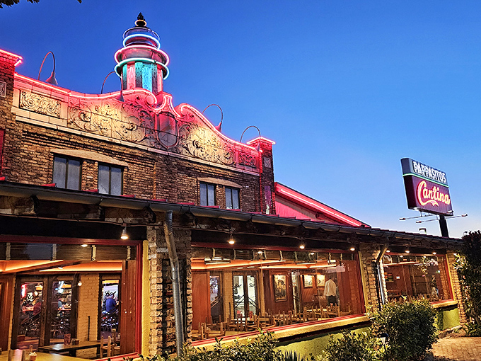 Pappasito's neon-lit exterior glows like a Tex-Mex lighthouse, beckoning hungry travelers with its colorful charm and promise of culinary adventure.