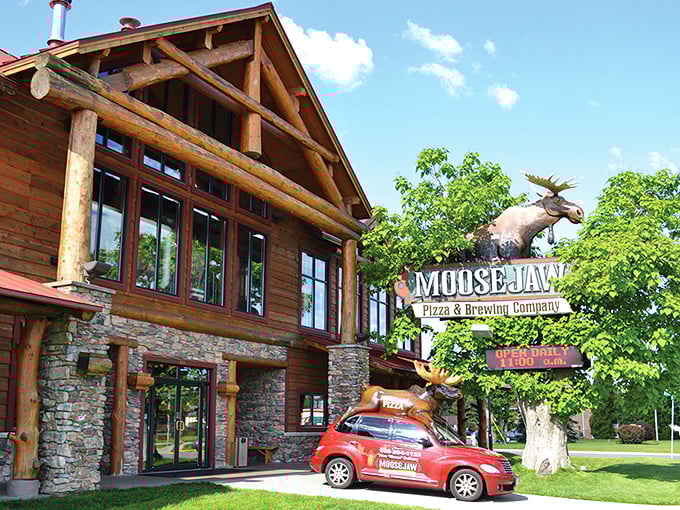 The log cabin palace of pizza rises from the Wisconsin landscape like Paul Bunyan's dream retirement home, complete with a watchful moose guardian.