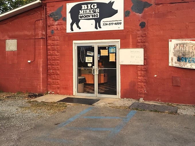 The unassuming red exterior of Big Mike's might not scream "culinary destination," but that smoky aroma wafting through the parking lot tells the real story.