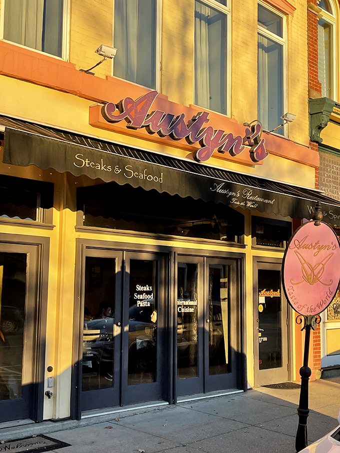 Austyn's golden facade catches the evening light like nature's Instagram filter – promising steaks, seafood, and zero pretentiousness inside.