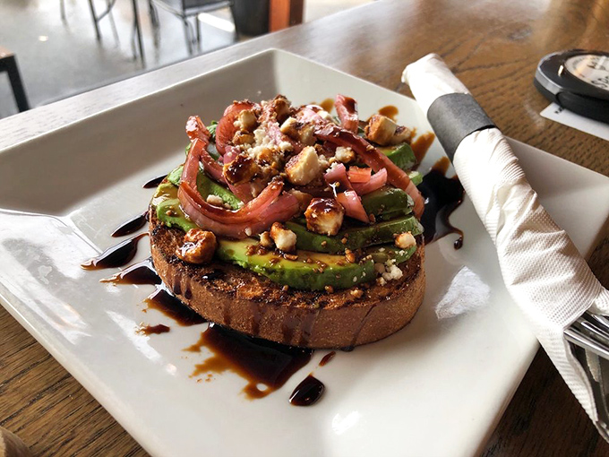 Avocado toast elevated to art form—this isn't your basic version, but a carefully constructed tower of flavors with balsamic drizzle for days.