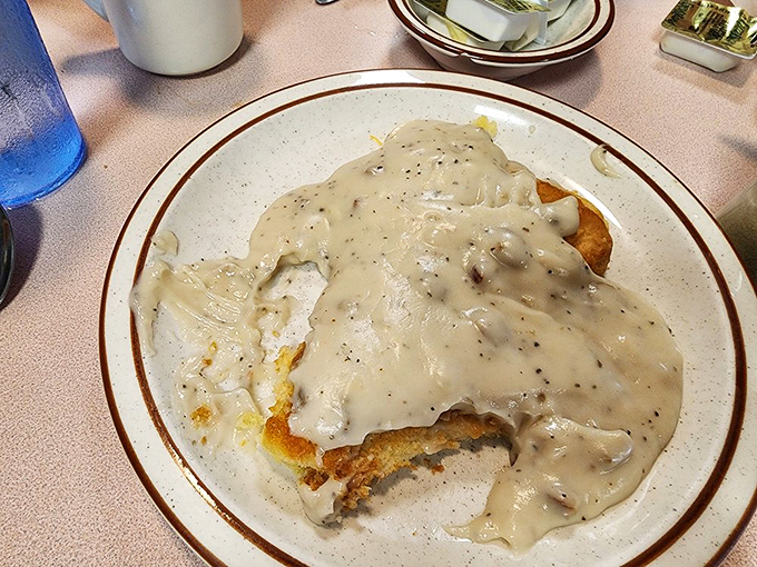 Biscuits smothered in peppery gravy—a Southern classic executed with respect. Comfort food that hugs you from the inside out.
