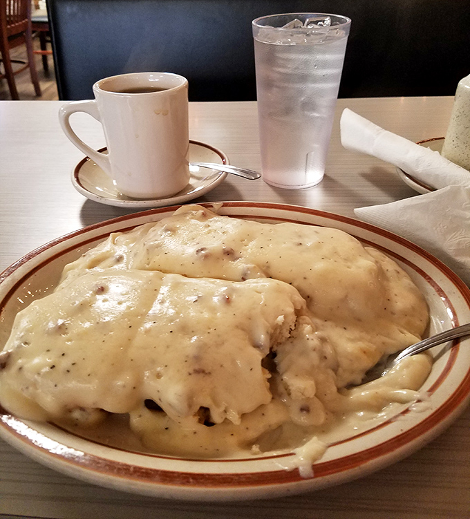 Biscuits and gravy—the Southern breakfast that hugs you from the inside. This plate doesn't just feed you; it adopts you.