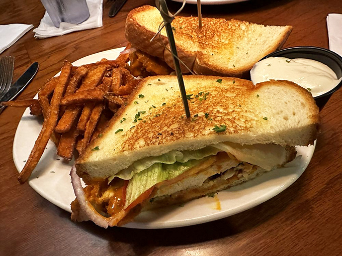 This sandwich isn't just stacked—it's architecturally sound. The kind of lunch that requires both hands and possibly a nap afterward.