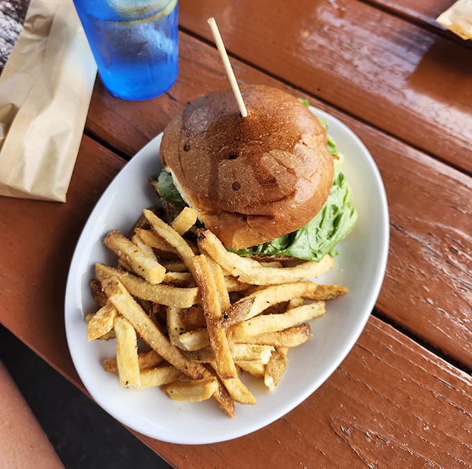 A burger sporting the Underdog logo branded right onto the bun—because when your food tastes this good, you put your stamp on it.
