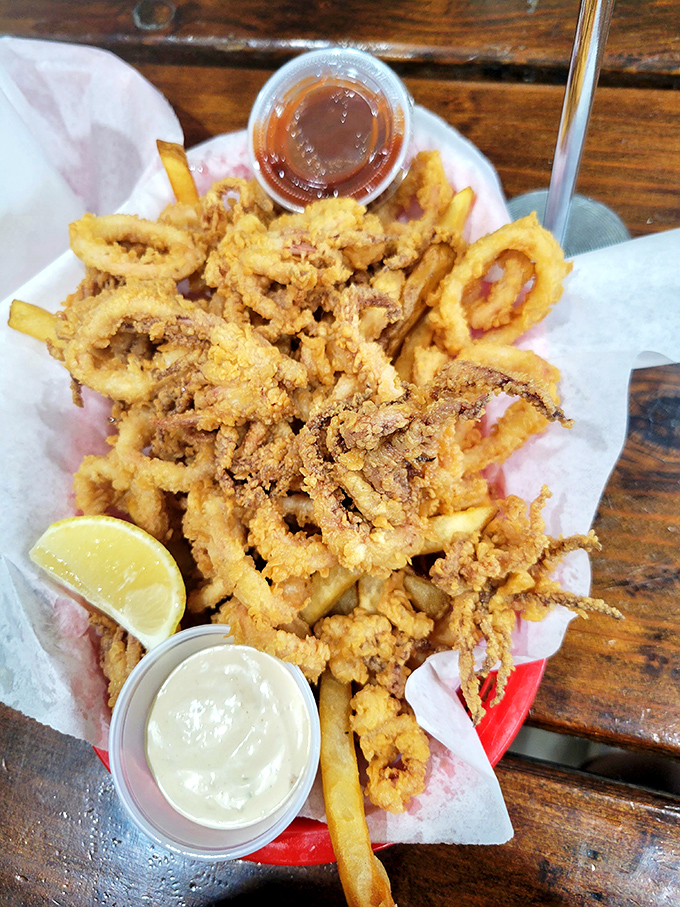 Calamari that defies the rubbery reputation of lesser versions—light, crisp, and tender enough to convert even the most skeptical seafood skeptics.