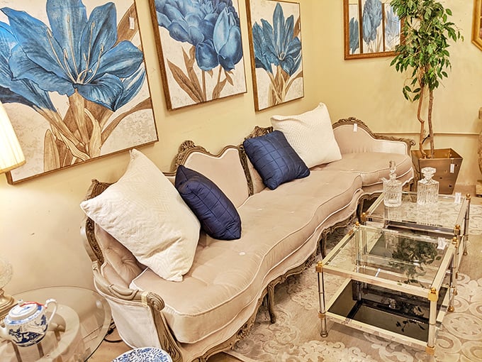 A sofa that says "I have excellent taste" paired with artwork that whispers "and I'm not afraid to show it."