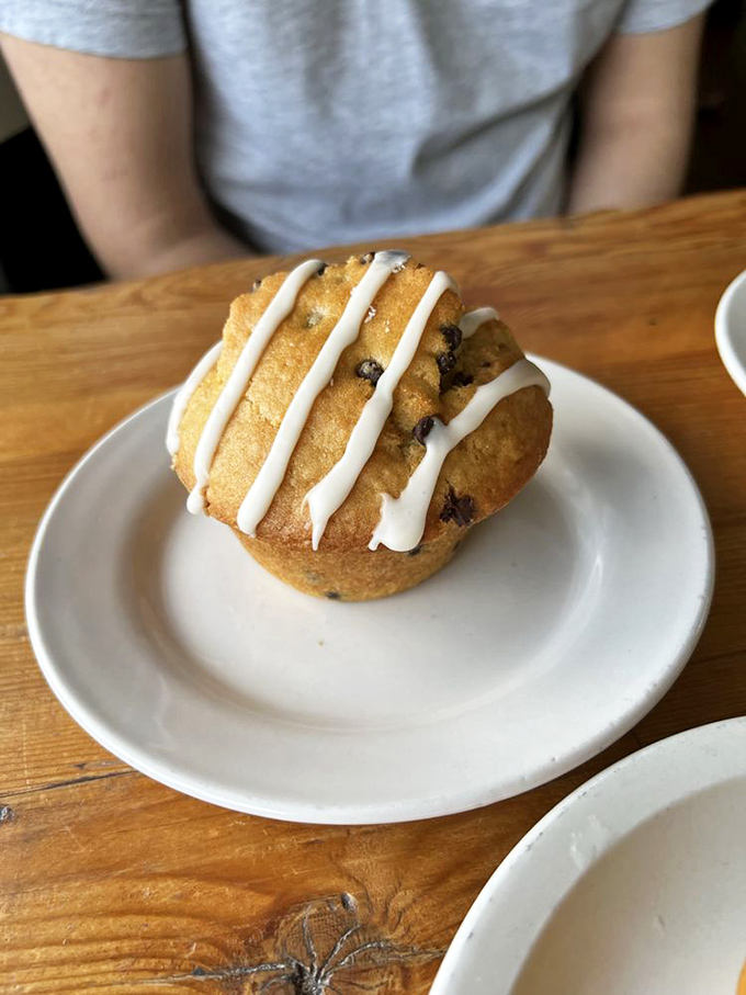 A muffin with frosting stripes is basically breakfast wearing a tuxedo—perfectly acceptable to eat before noon, but fancy enough for anytime.