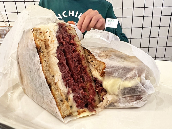 This isn't just lunch—it's a work of art. The corned beef is sliced so perfectly thin you could read the newspaper through it.