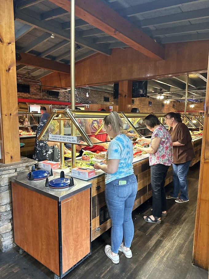 Patrons navigate the buffet with the focused determination of treasure hunters who've found the X on their map. Everyone's on a delicious mission.
