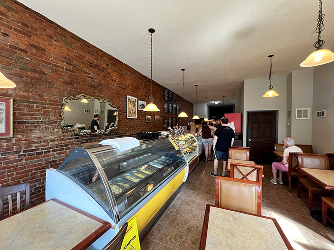 Where pastry dreams come true. The curved display case houses treasures more valuable than gold—if your currency is measured in butter, sugar, and generations of Italian baking wisdom. 