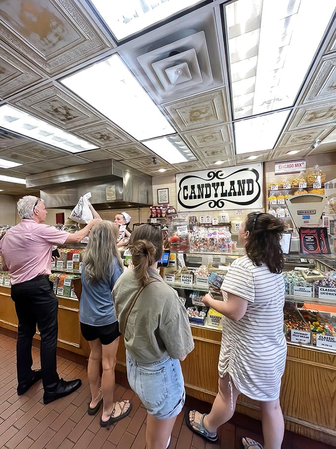 Customers of all ages experiencing that universal moment of candy-induced paralysis – too many choices, too little stomach capacity.