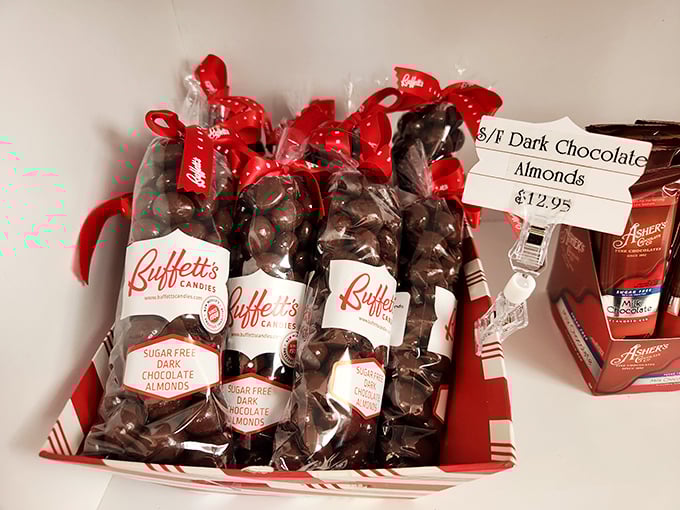 Sugar-free dark chocolate almonds nestled in festive baskets. The red ribbons aren't just decorative – they're holding back an avalanche of flavor.