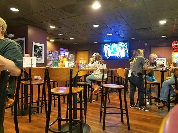 Where burger magic happens. These patrons aren't just eating—they're participating in a Minnesota ritual that transcends mere hunger.