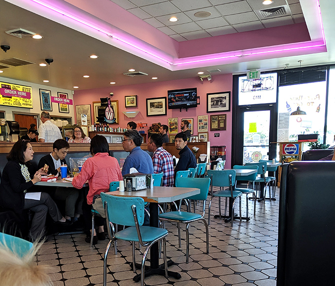 Not just customers—these are pilgrims at the altar of good food, sharing the communal joy that only comes from breaking bread in a beloved local spot.