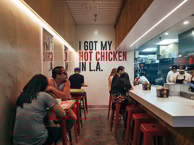 The wall says it all: "I GOT MY HOT CHICKEN IN L.A." Not a statement—it's a badge of honor earned through delicious suffering.