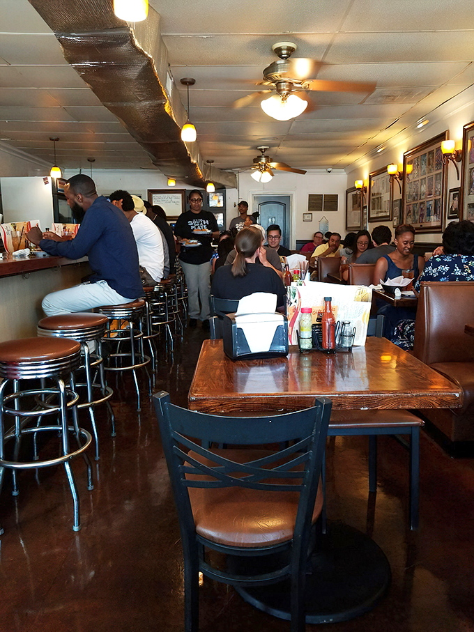 No empty seats, no pretension—just people united in the pursuit of exceptional soul food. Democracy looks like everyone getting equal access to great chicken.