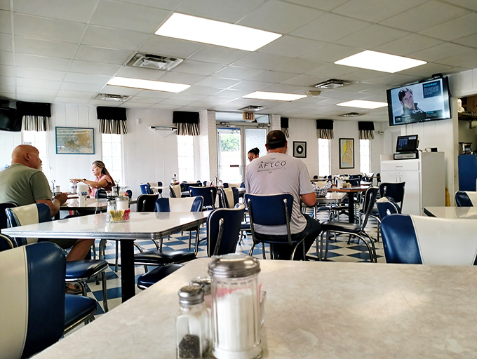 Morning regulars settle in for breakfast and conversation—the true rhythm of any great diner is the community that gathers within its walls.