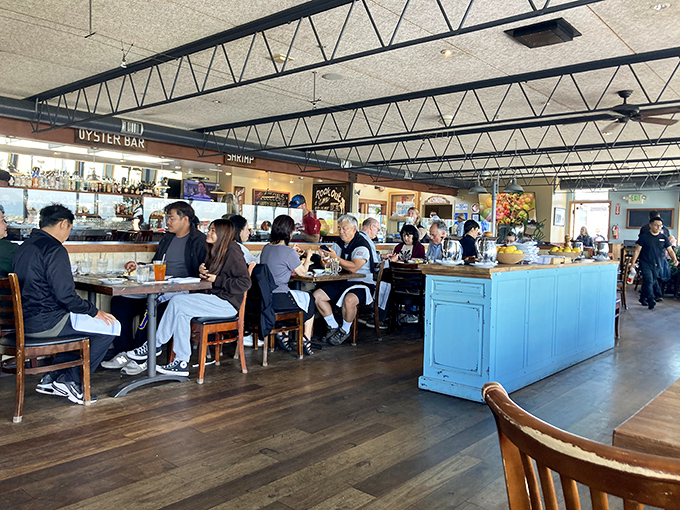 The oyster bar—where strangers become friends united by their willingness to slurp shellfish in public without shame.