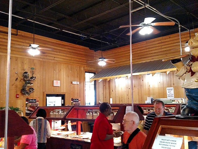 The buffet line—where strangers become comrades united in the noble pursuit of that perfect piece of fried chicken.