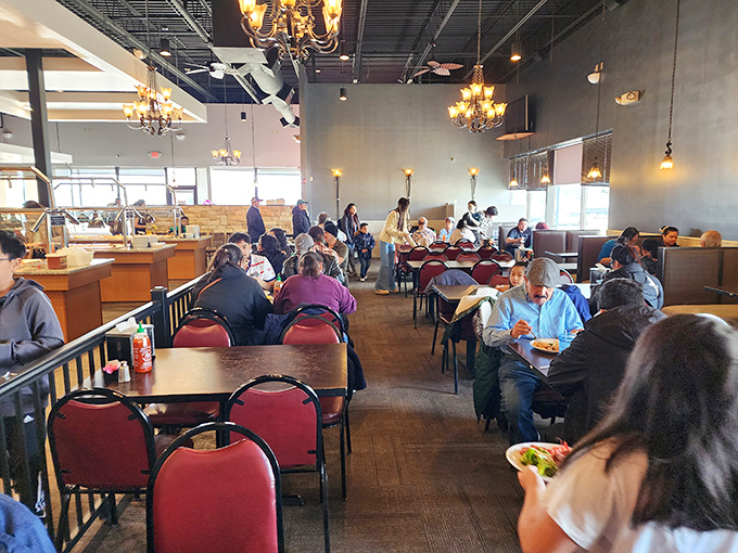 The universal language of buffet dining: plates in hand, eyes scanning for the next delicious discovery, a community united by good food.