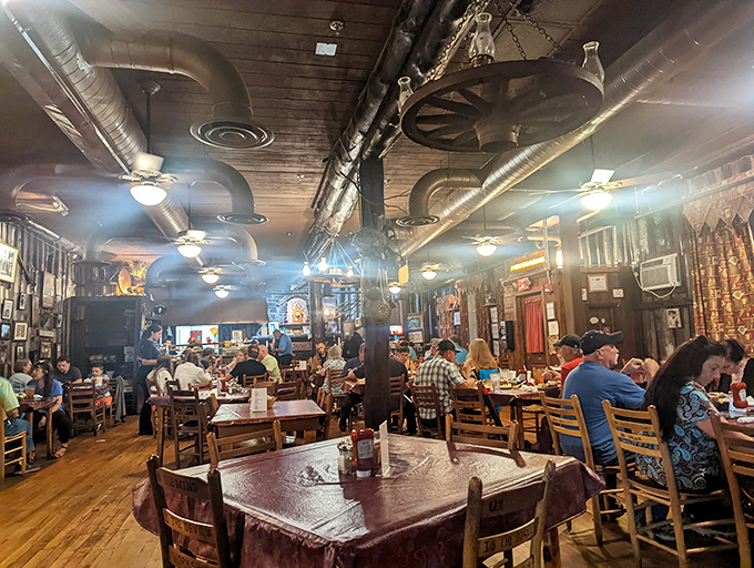 The packed dining room speaks volumes—these aren't just customers, they're pilgrims who've found their carnivorous promised land amid wooden beams and checkered tablecloths.