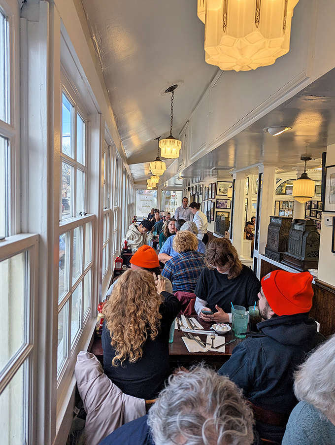 The narrow dining room buzzes with conversation and anticipation—a community united by the universal language of exceptional sandwiches.