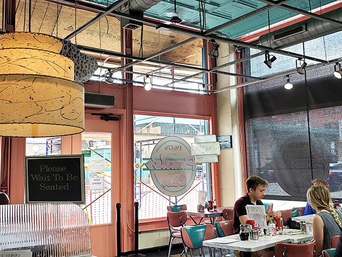 "Please Wait To Be Seated" isn't just a sign—it's a promise that patience will be rewarded with breakfast bliss.
