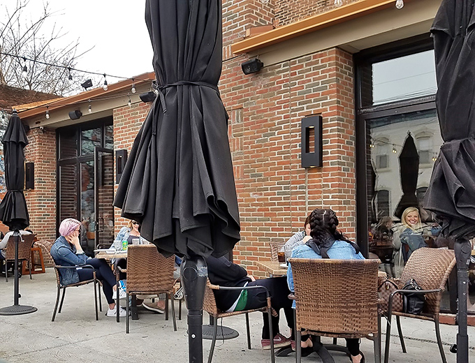 Outdoor dining at The South Side—where people-watching meets comfort food in Tremont's urban landscape. No filter needed for this Cleveland vignette. 
