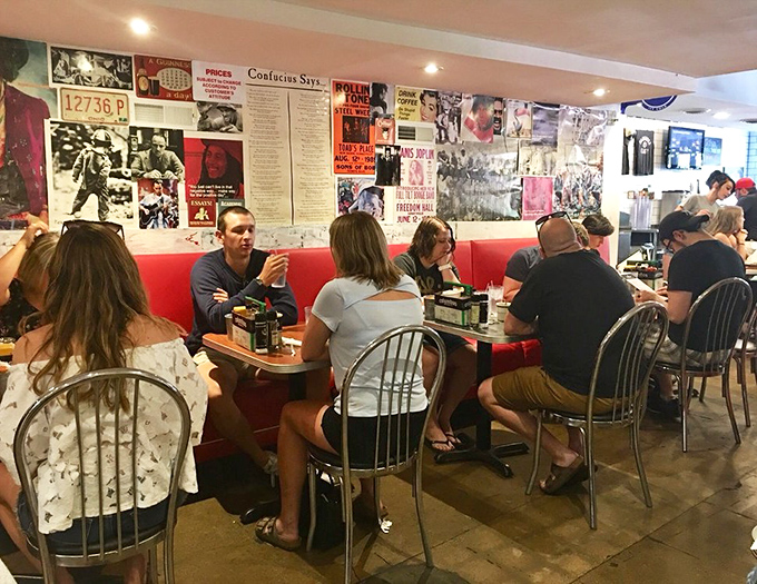 Breakfast as a social event—where conversations flow as freely as the coffee. The red booths have probably heard more campus secrets than any university counselor.