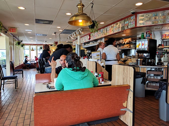 The counter seats – where solo diners become temporary family and regulars exchange life stories between sips of bottomless coffee.